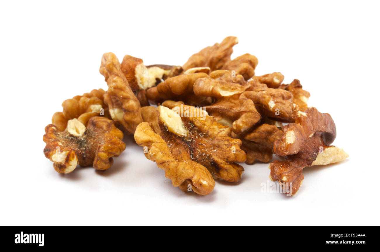 Crushed walnuts on white background Stock Photo - Alamy