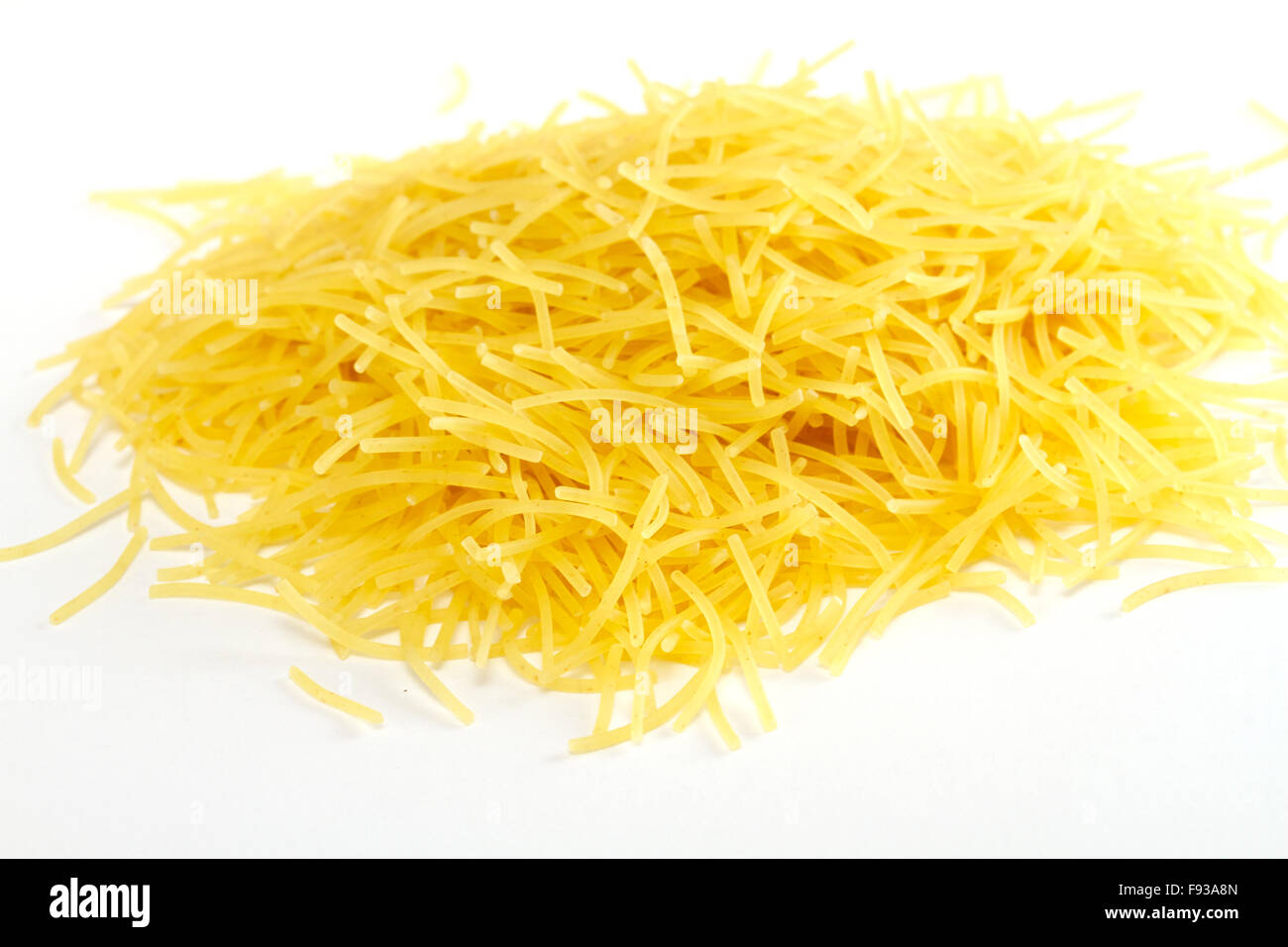 dried italian pasta (macaroni) isolated on white background Stock Photo ...