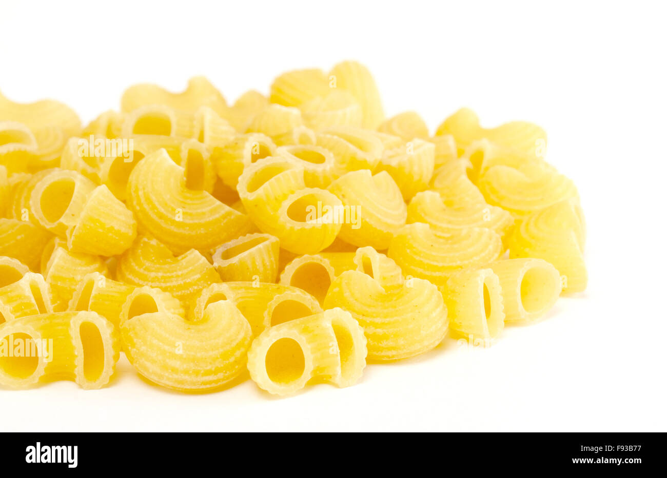 dried italian pasta (macaroni) isolated on white background Stock Photo ...
