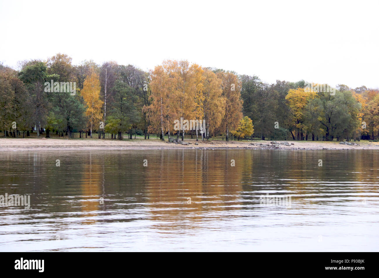 Colorful autumn trees fortress at the river front Stock Photo - Alamy