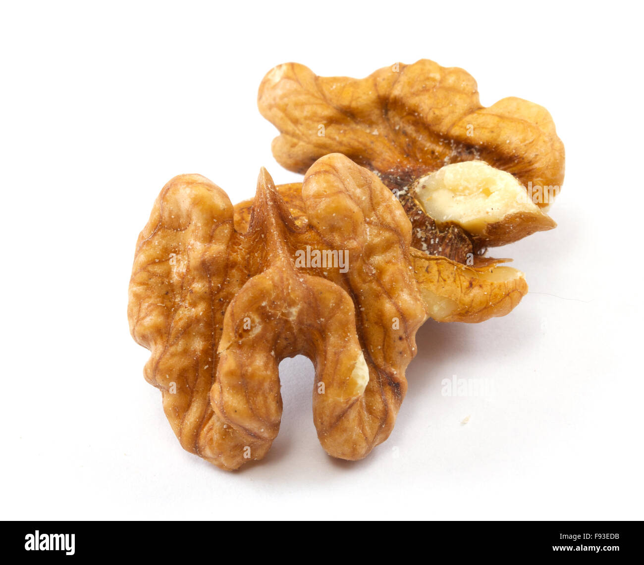 Crushed walnuts on white background Stock Photo - Alamy