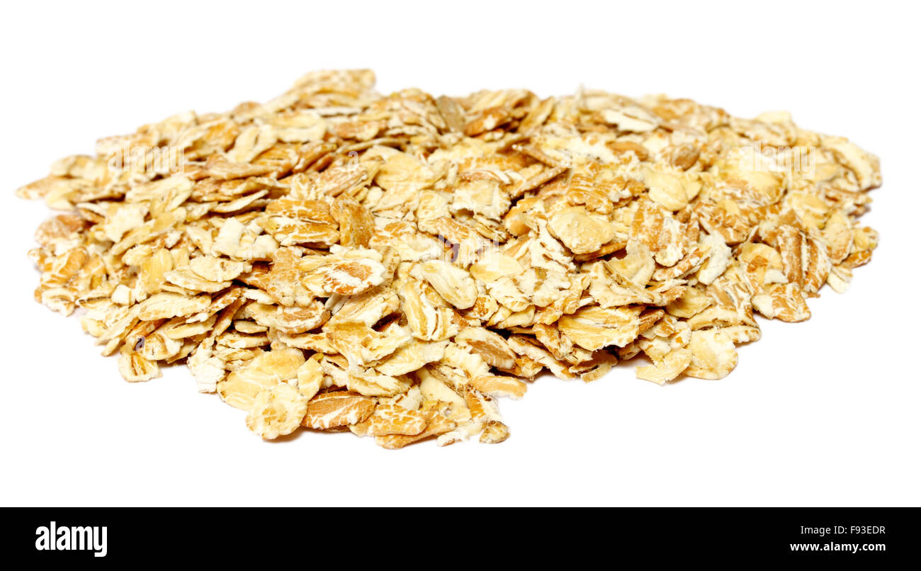Heap of dry rolled oats isolated on white background Stock Photo - Alamy