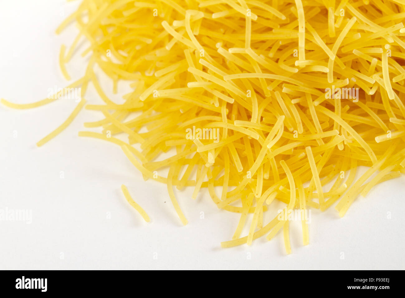 dried italian pasta (macaroni) isolated on white background Stock Photo ...