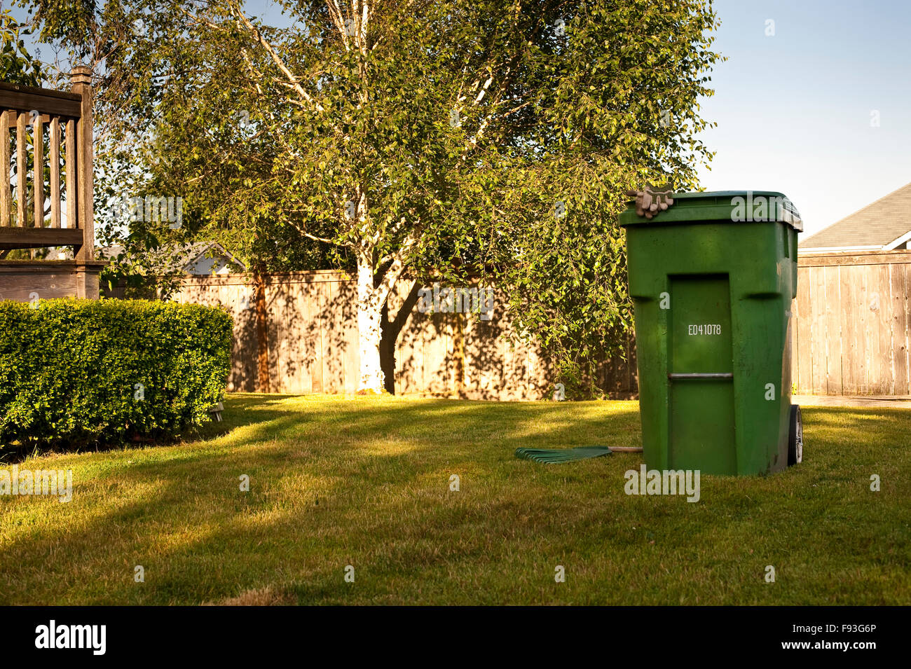 Yard work clean up and mowing with recycling bin Stock Photo - Alamy