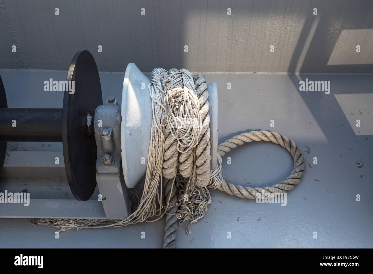 Close up detailed top view of grey nautical rope at an open deck of a ...