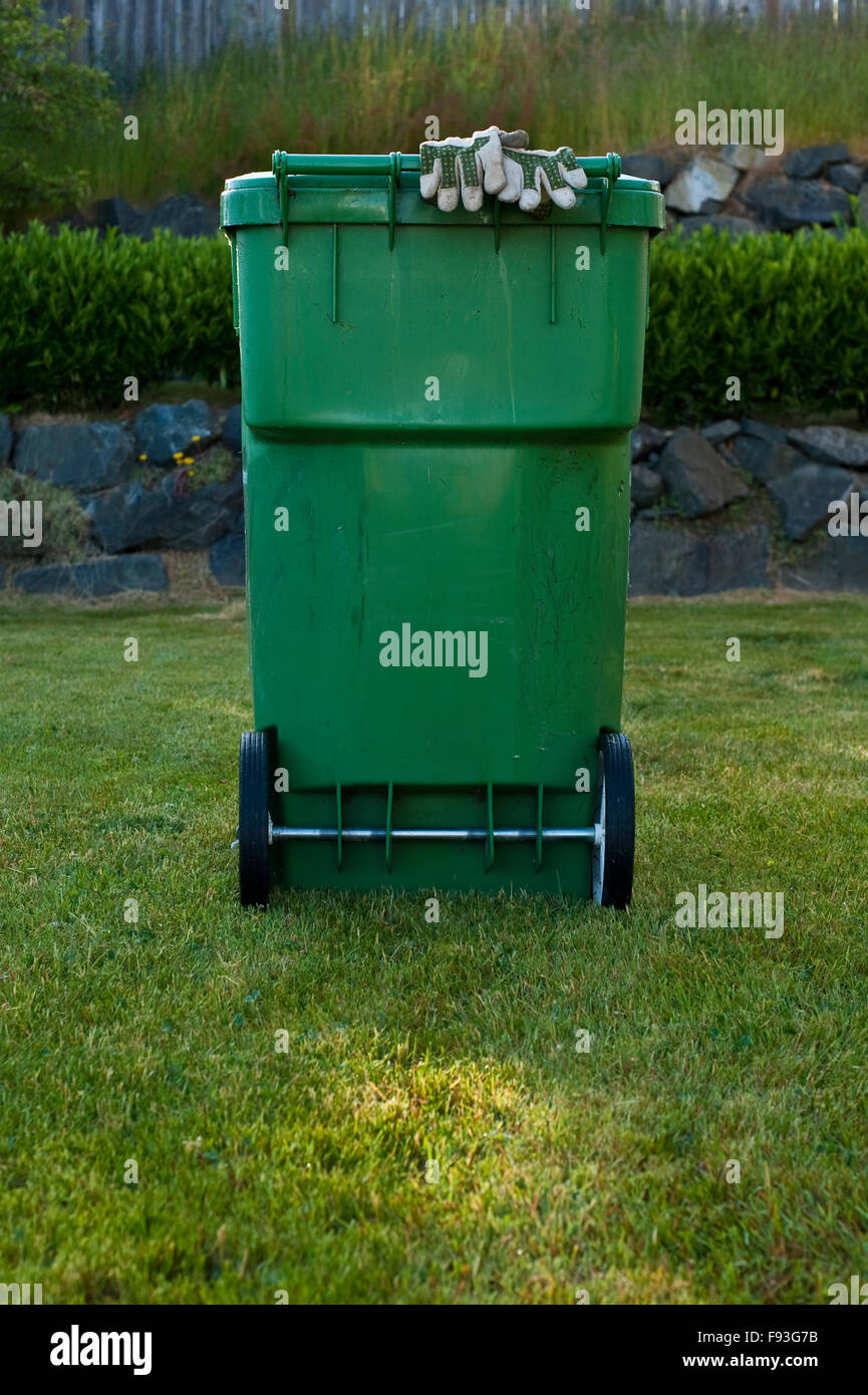 Yard work clean up and mowing with recycling bin Stock Photo - Alamy