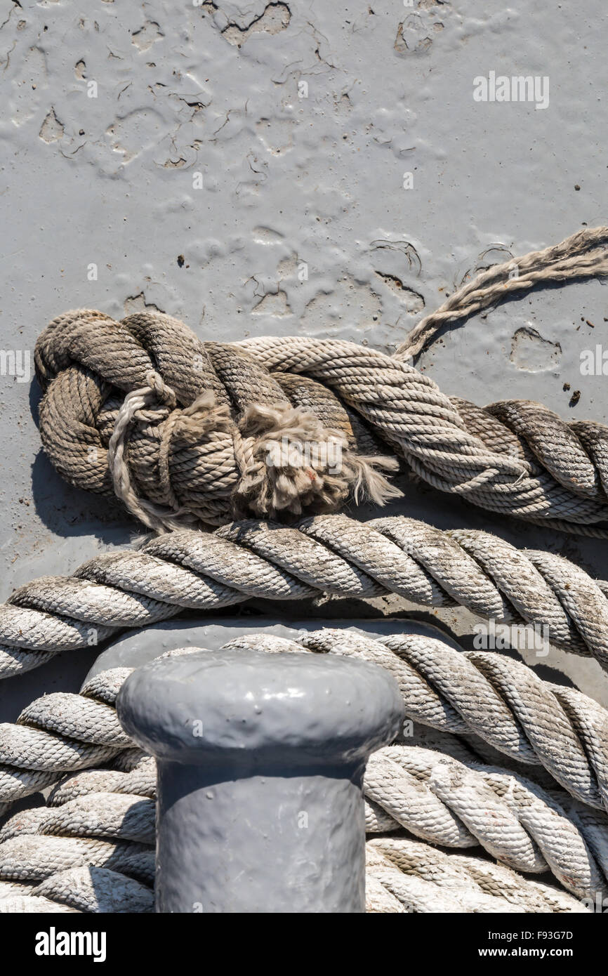 Close up detailed top view of grey nautical rope at an open deck of a ...