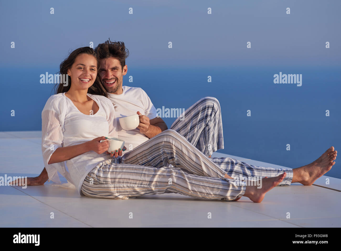 happy young romantic couple have fun relax smile at modern home outdoor ...
