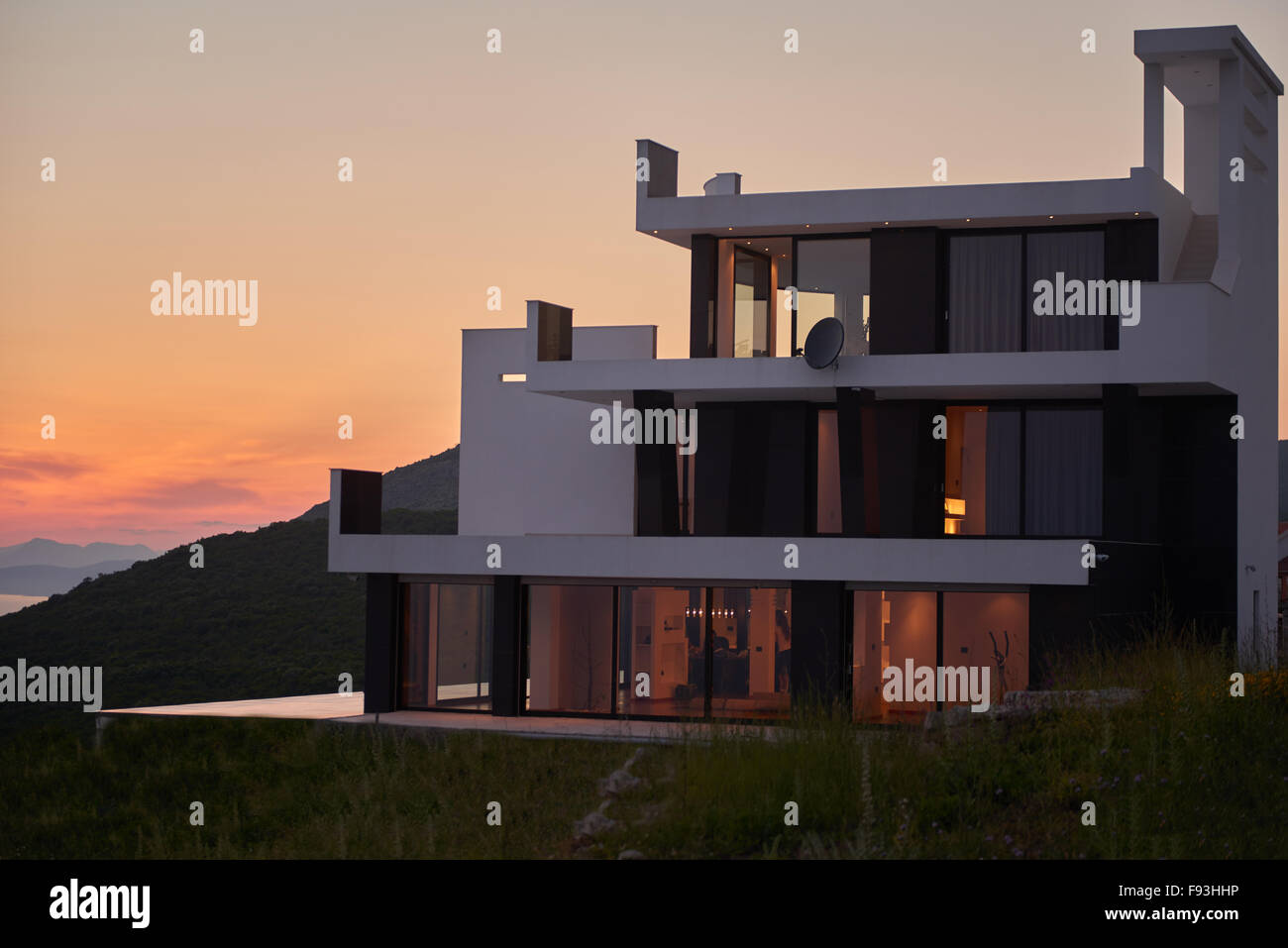 External view of a contemporary house modern villa at sunset Stock ...