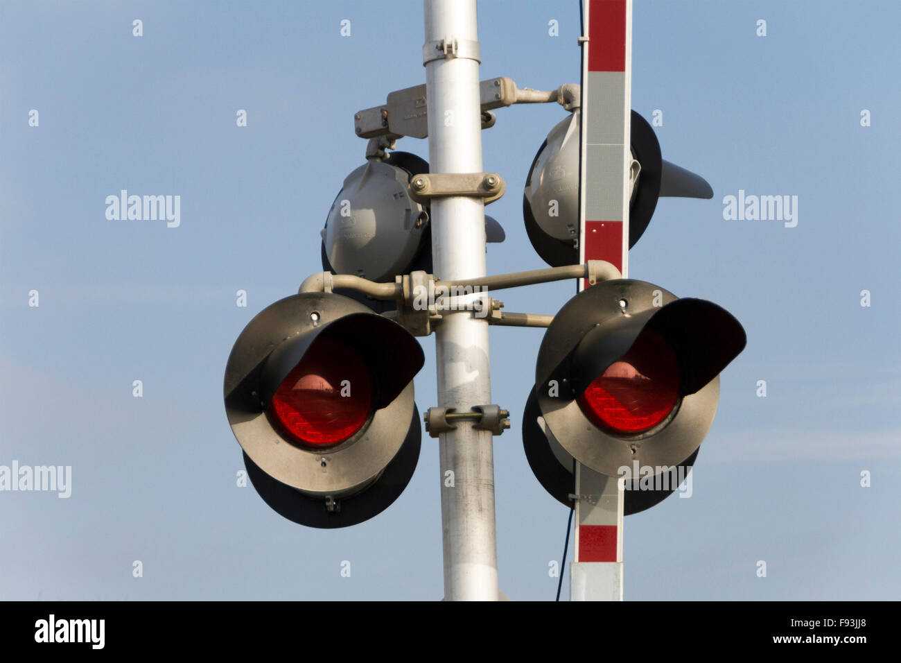 Red railway lights at a train crossing Stock Photo - Alamy