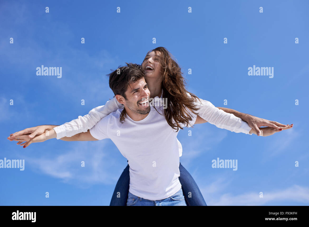 happy young romantic couple have fun relax smile at modern home outdoor ...
