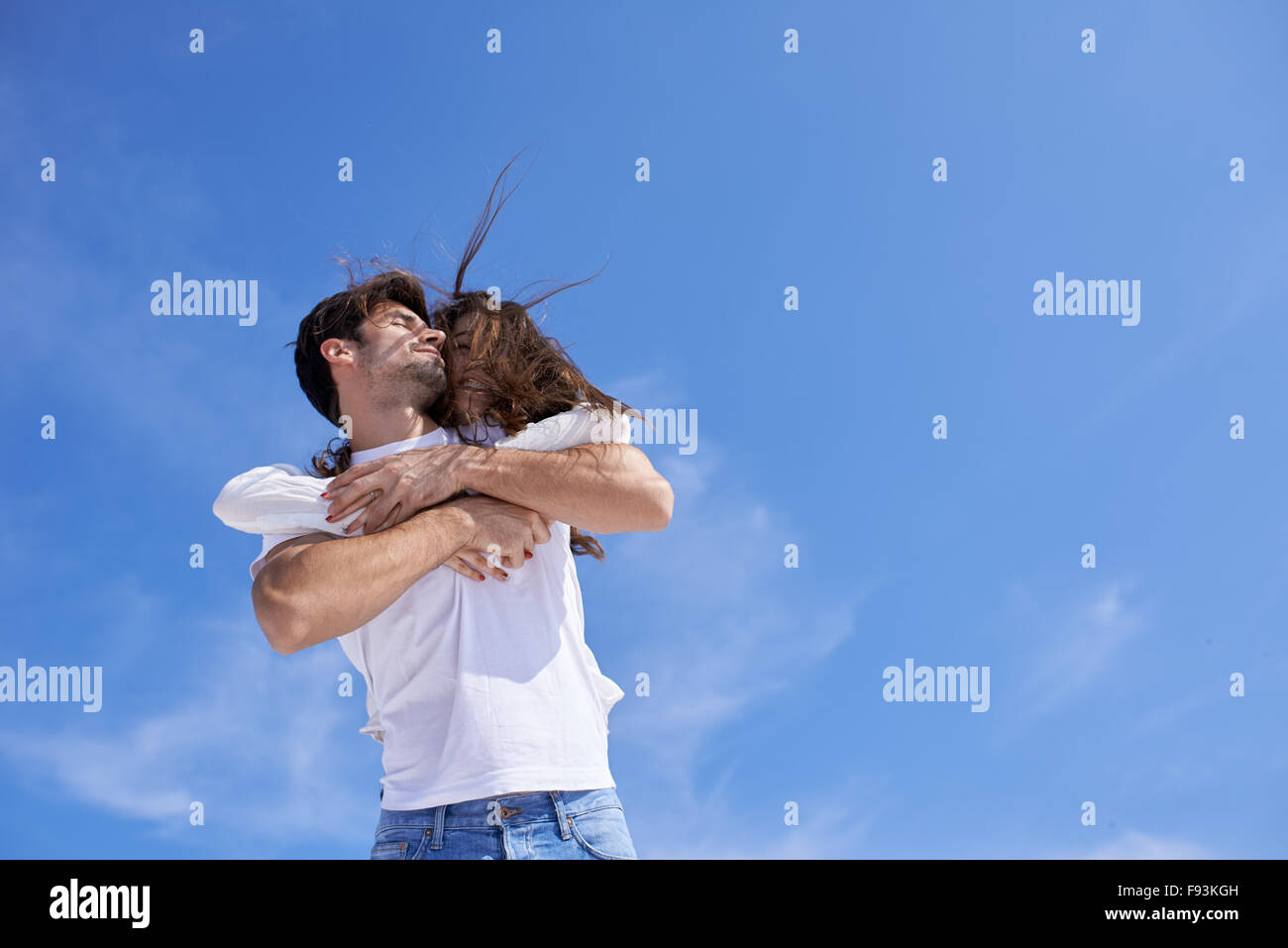happy young romantic couple have fun relax smile at modern home outdoor ...