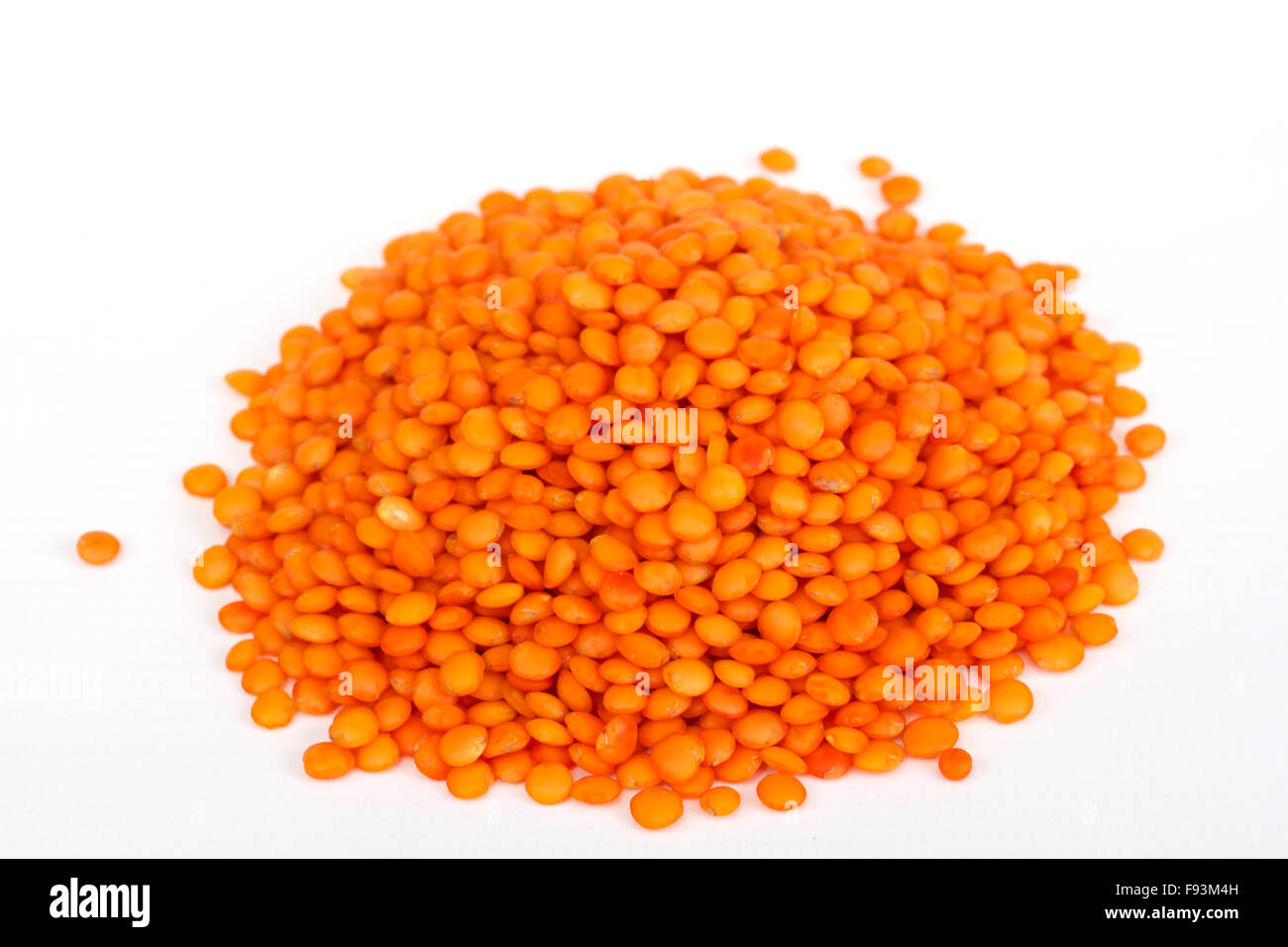 Heap of raw red lentils isolated on white background Stock Photo - Alamy