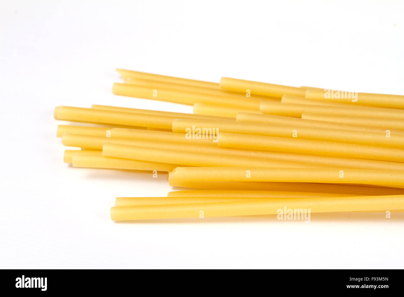 uncooked spaghetti noodles isolated on white background Stock Photo - Alamy
