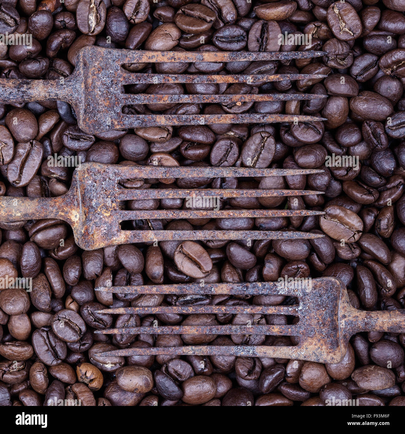 Coffee beans and old rusty forks abstract still life Stock Photo - Alamy