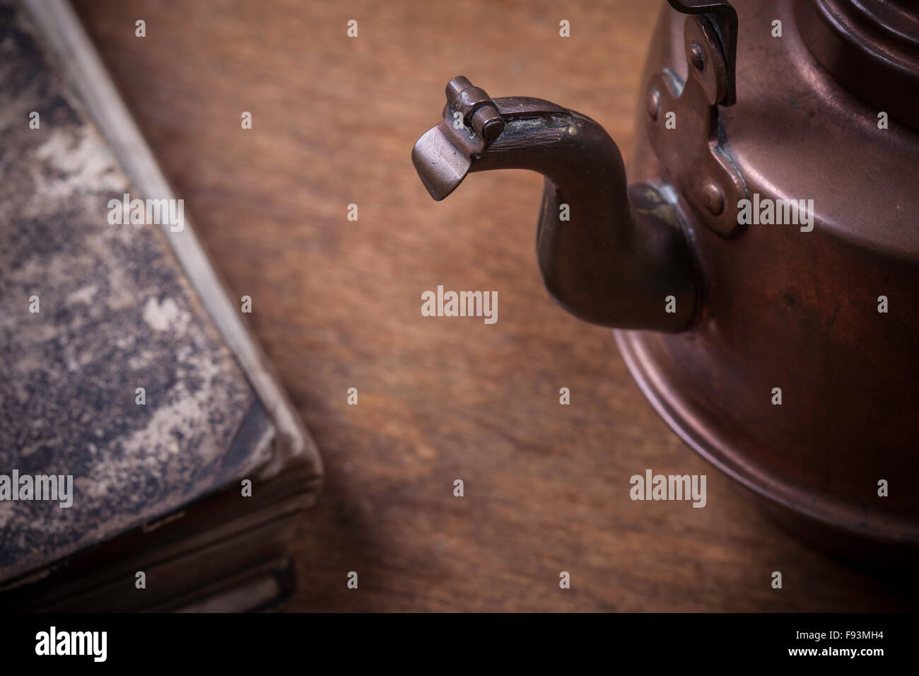 old kettle on a grunge wooden surface Stock Photo - Alamy