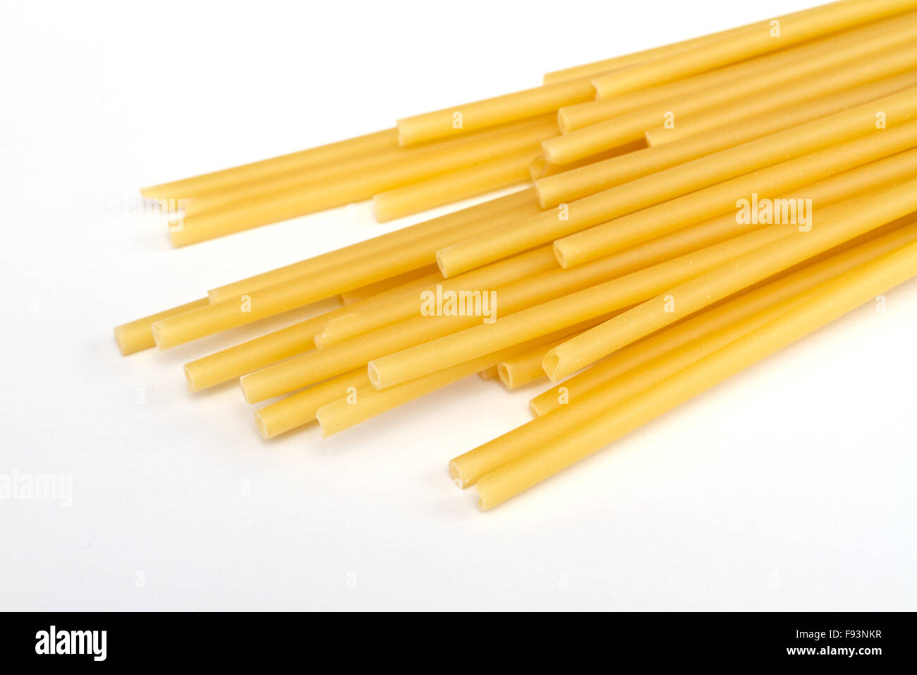 uncooked spaghetti noodles isolated on white background Stock Photo - Alamy