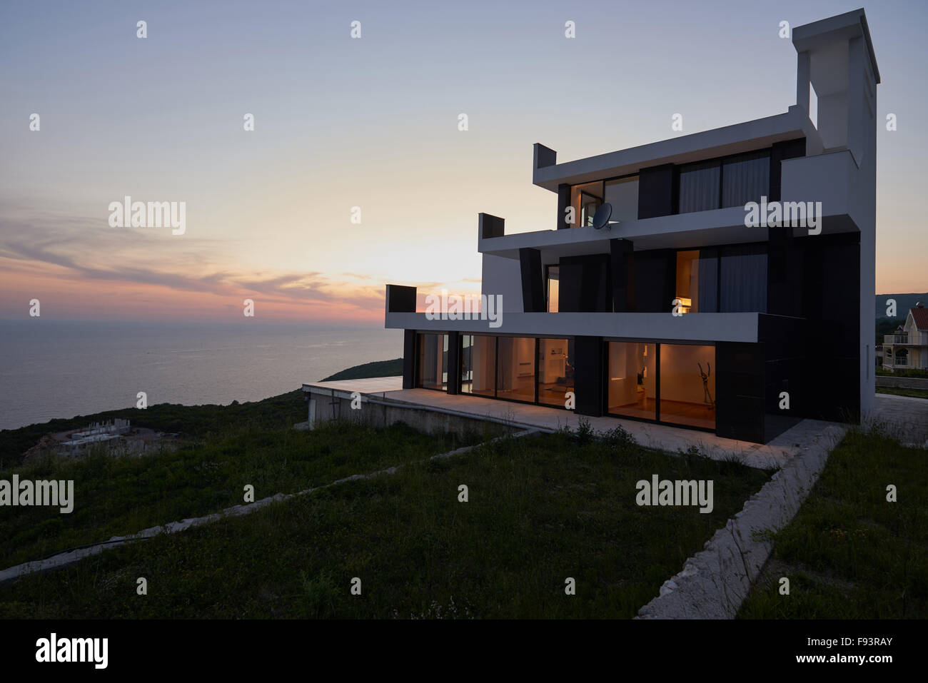 External view of a contemporary house modern villa at sunset Stock ...