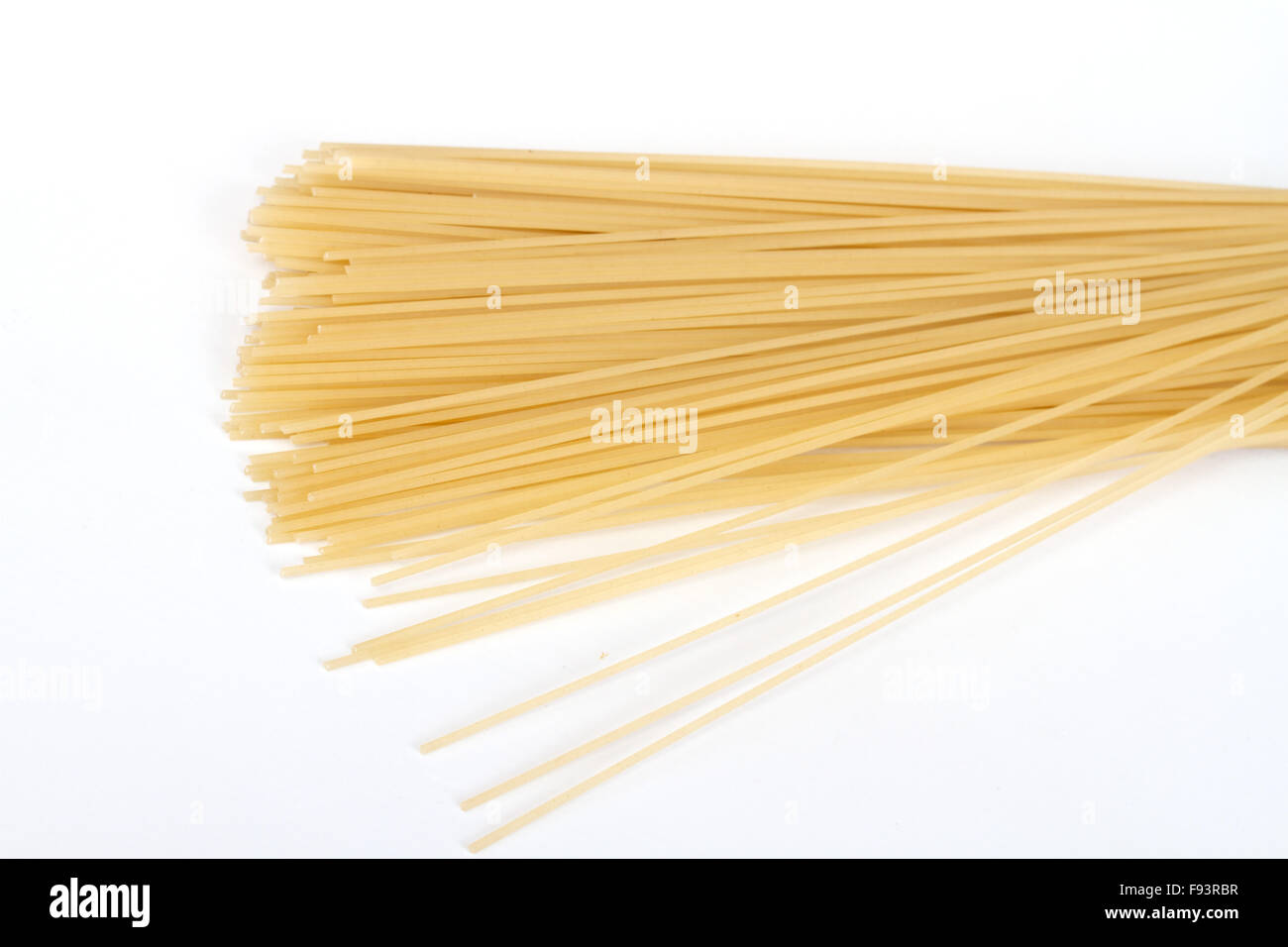 uncooked spaghetti noodles isolated on white background Stock Photo - Alamy