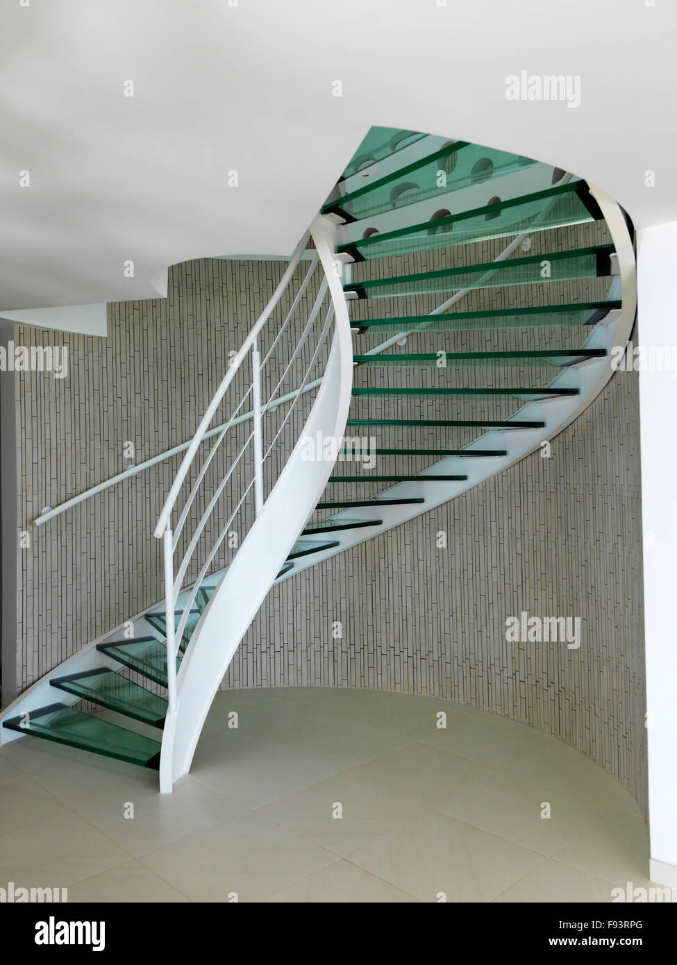 modern glass spiral staircase with metallic hand-rails Stock Photo - Alamy