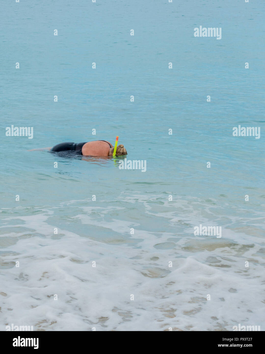 A woman enjoys snorkeling off the beach of St. Croix, U.S. Virgin ...