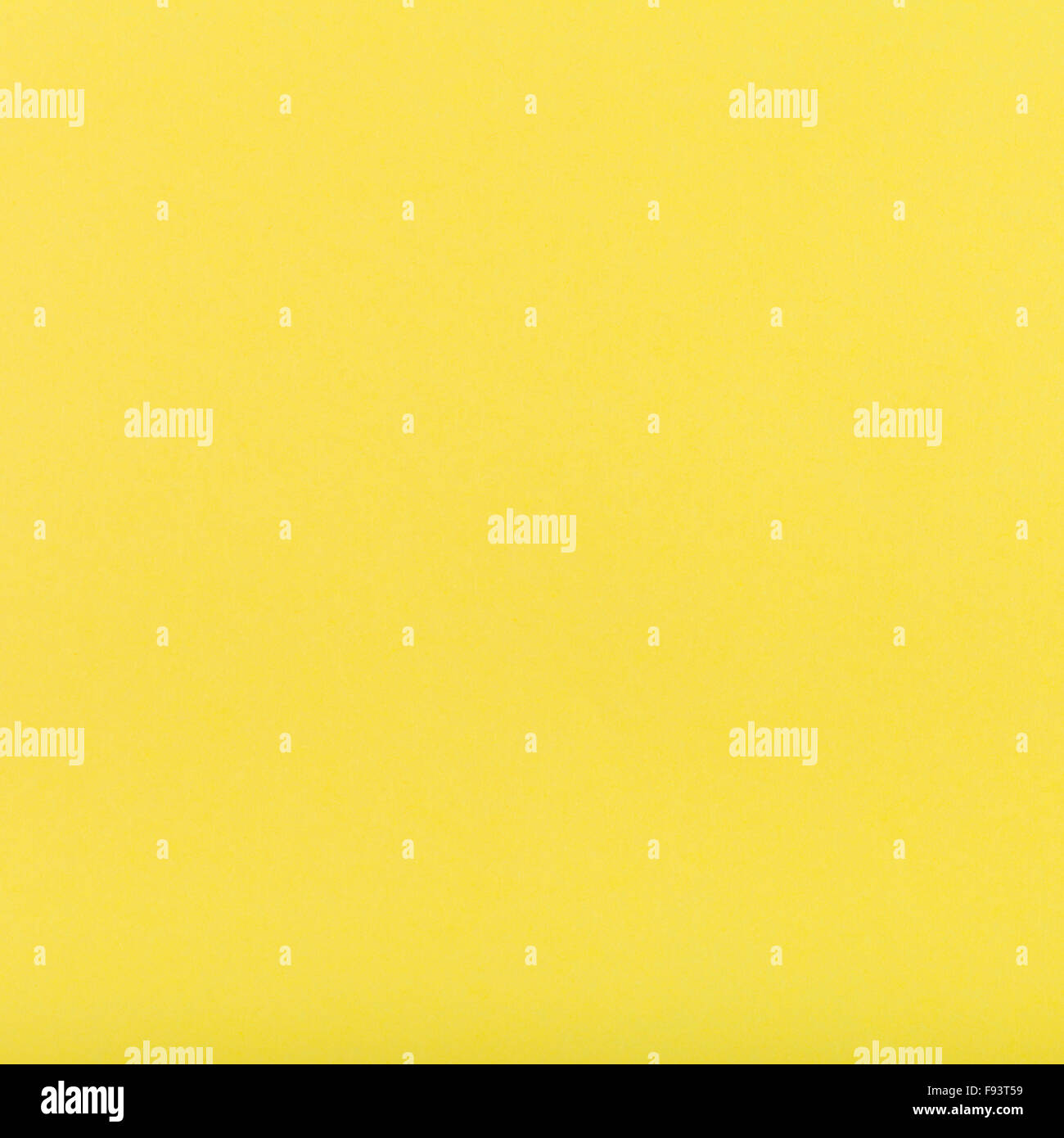 square background from yellow color toned sheet of paper Stock Photo ...