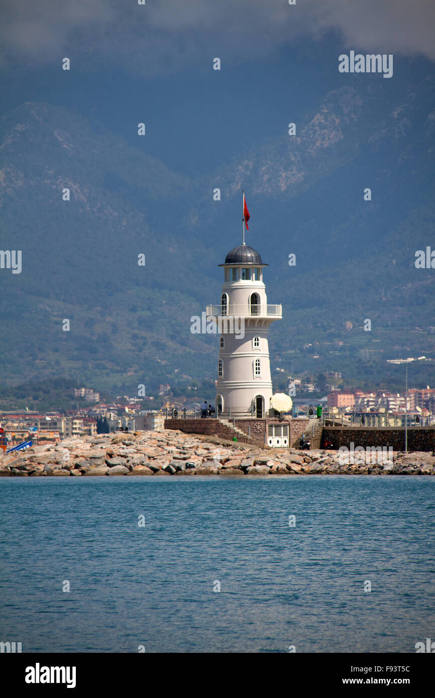 Lighthouse in port. Turkey, Alanya. Sunny weather Stock Photo - Alamy