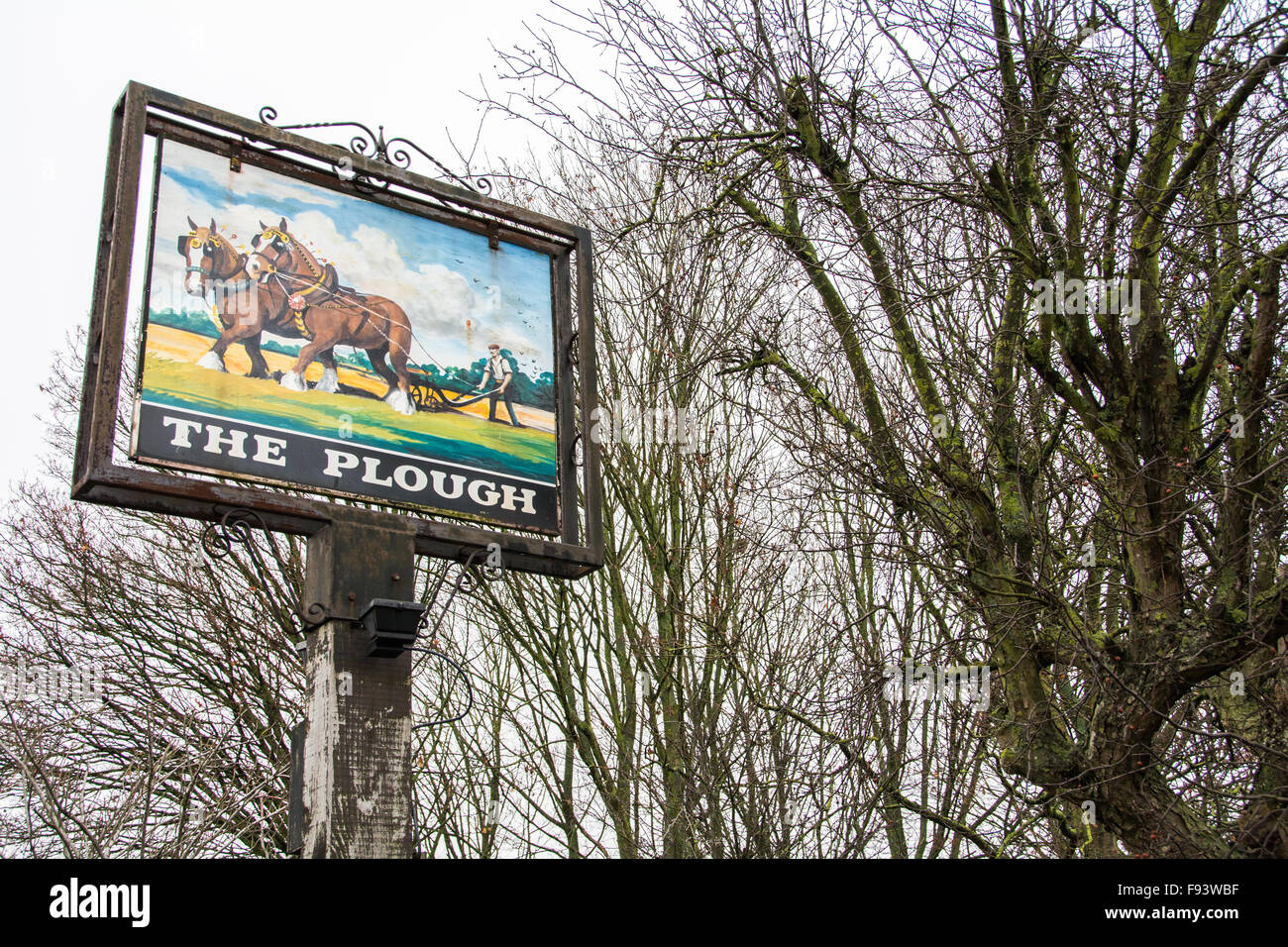 A pub sign outside the Plough pub in Sipson, an ancient village ...