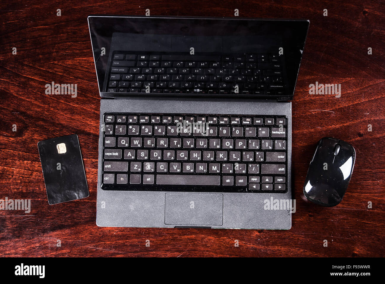 black laptop on wood Stock Photo - Alamy