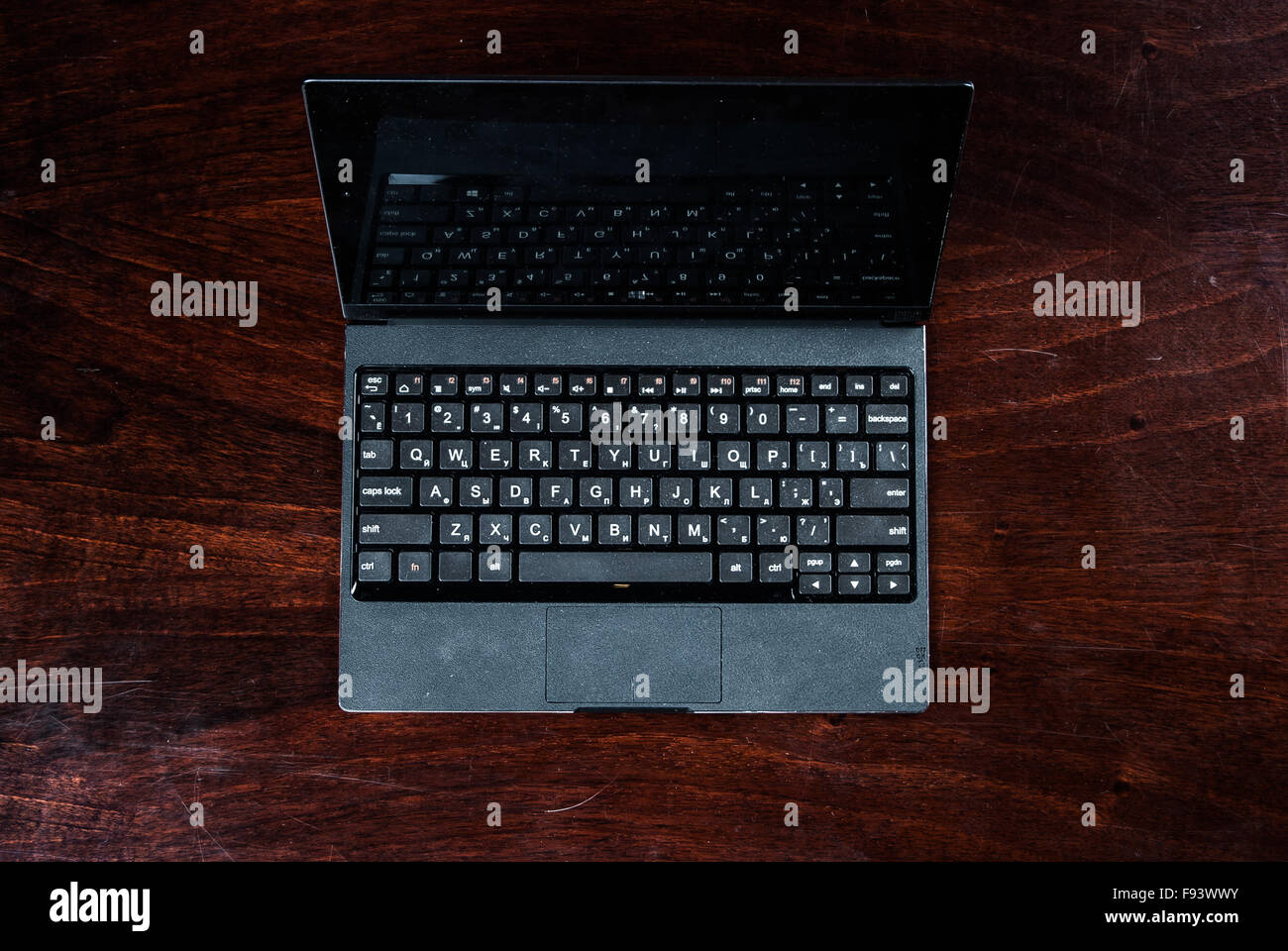 black laptop on wood Stock Photo - Alamy