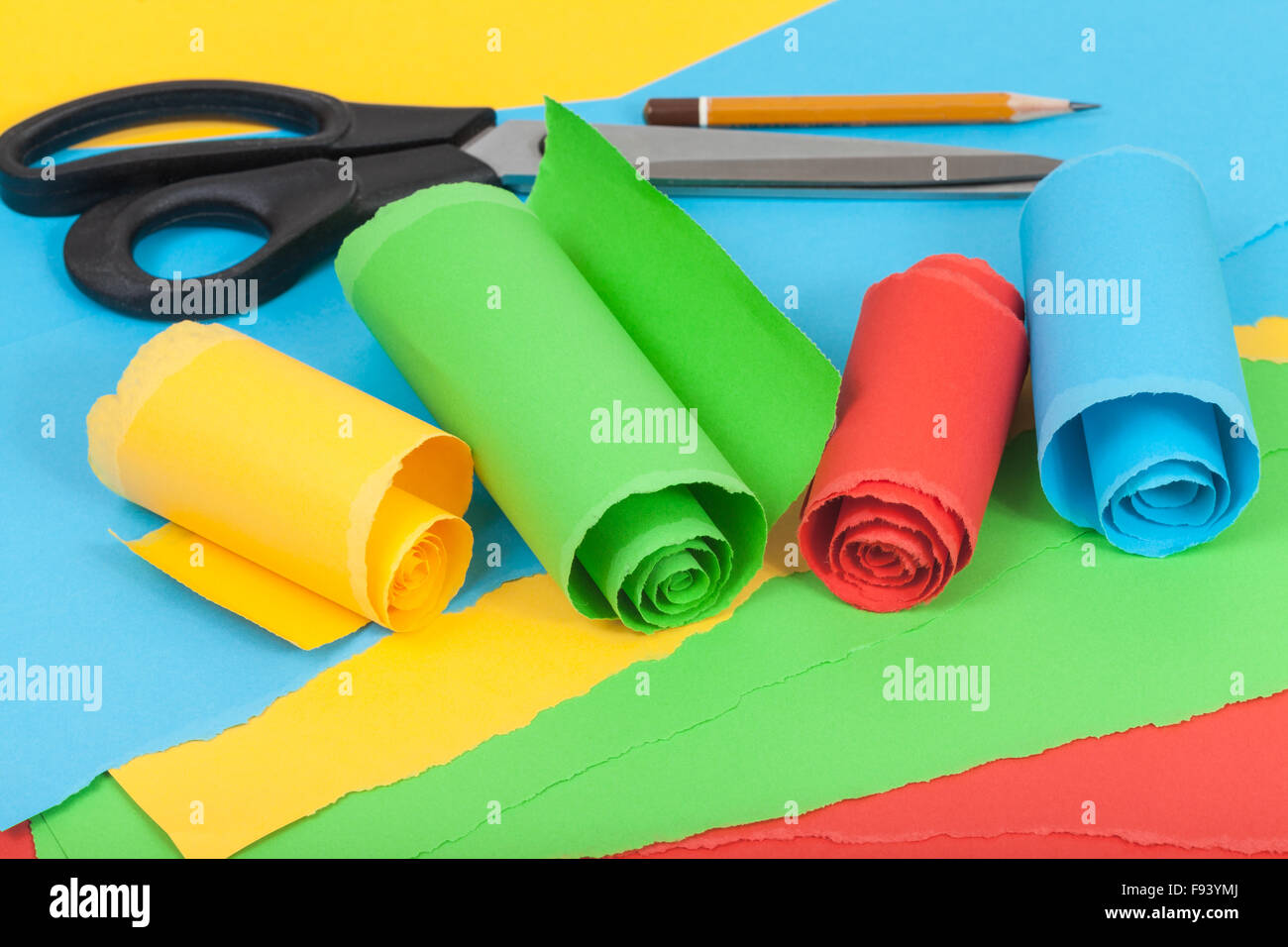 still life - creative material from rolled color paper on sheets of ...