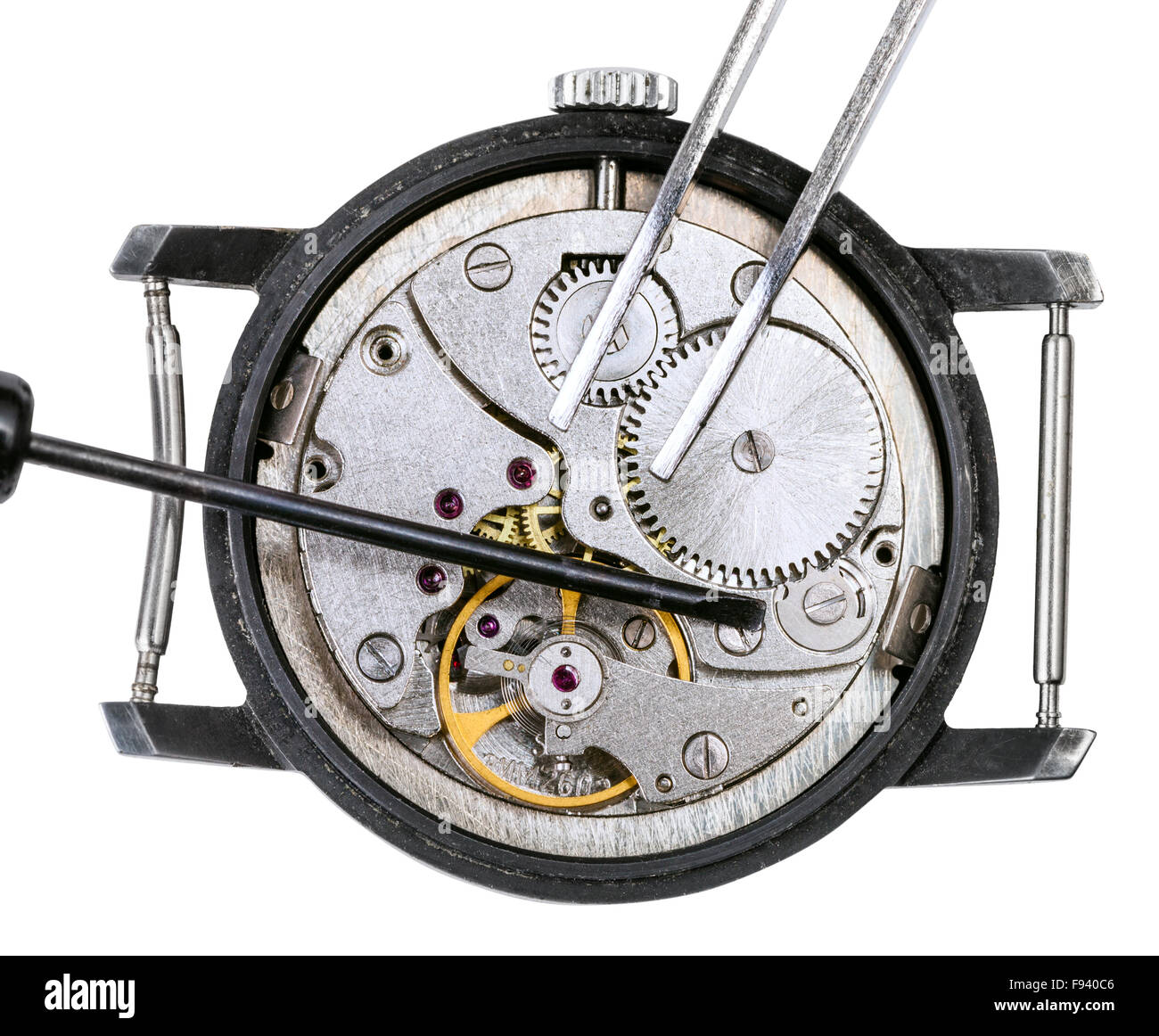 adjusting old mechanic wristwatch - above view of screwdriver and ...