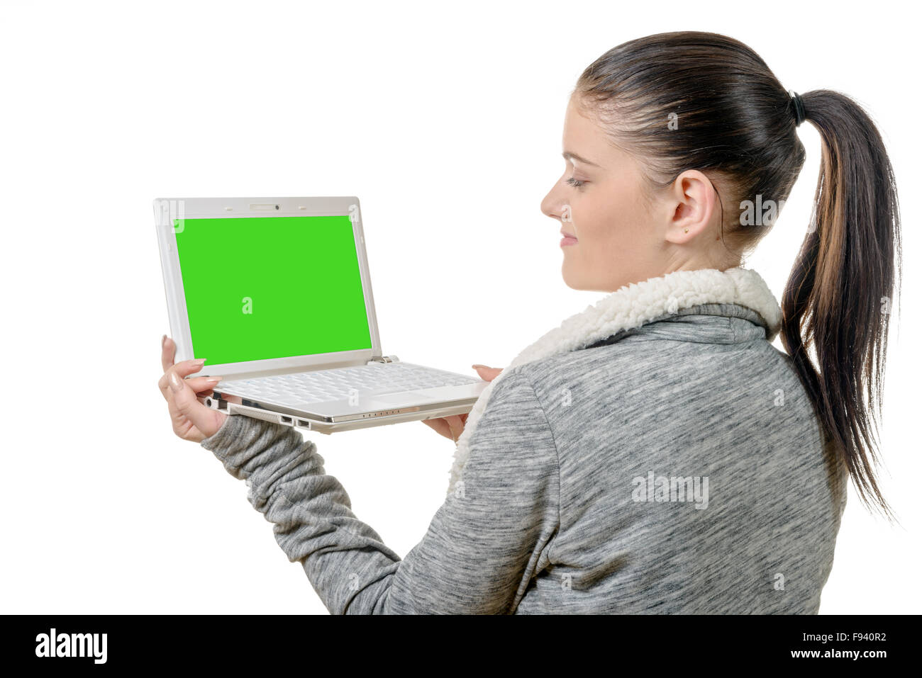 a portrait of beautiful girl using laptop with green screen Stock Photo ...