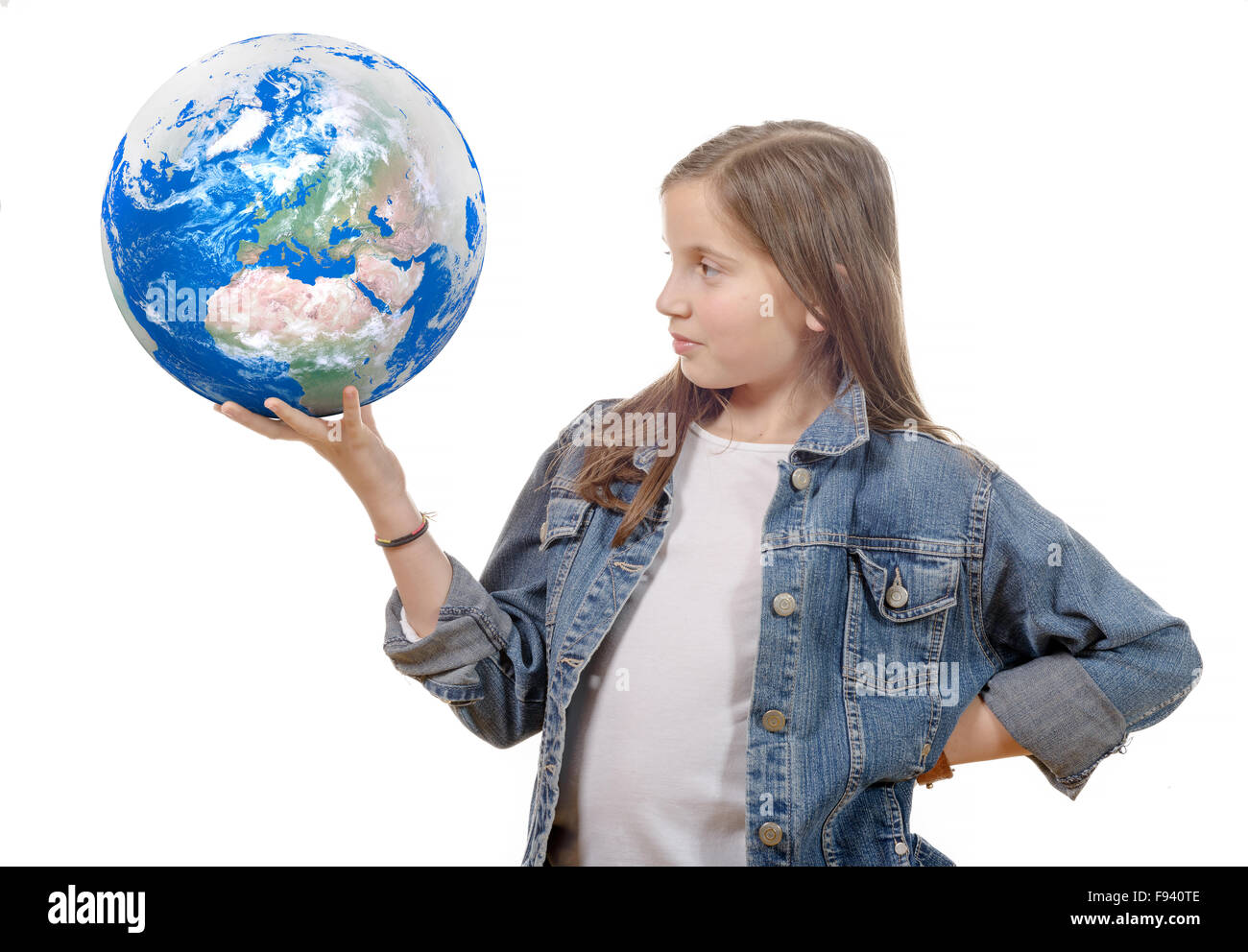 a little girl holding a world globe, isolated on a white background ...