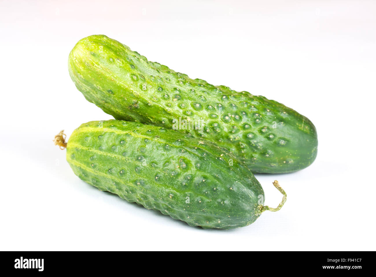 two cucumbers isolated on a white Stock Photo - Alamy