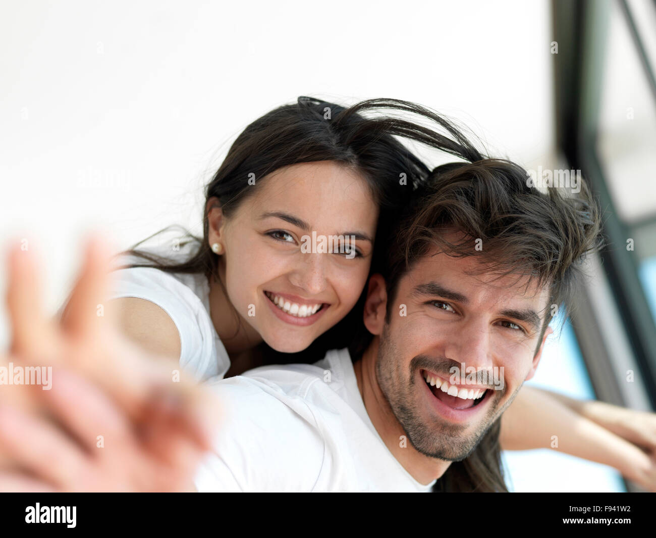romantic happy young couple relax at modern home indoors and have fun ...