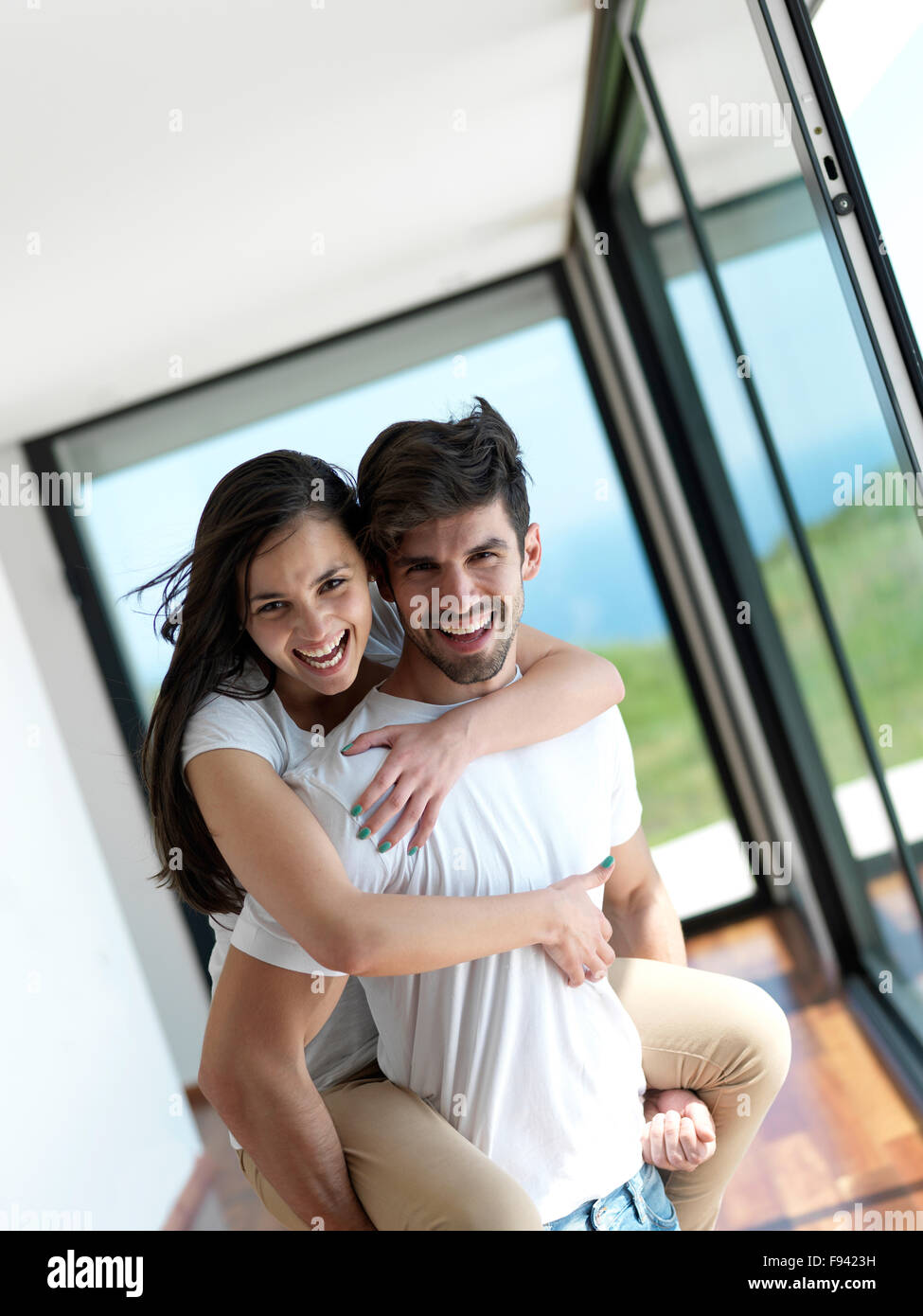 romantic happy young couple relax at modern home indoors and have fun ...
