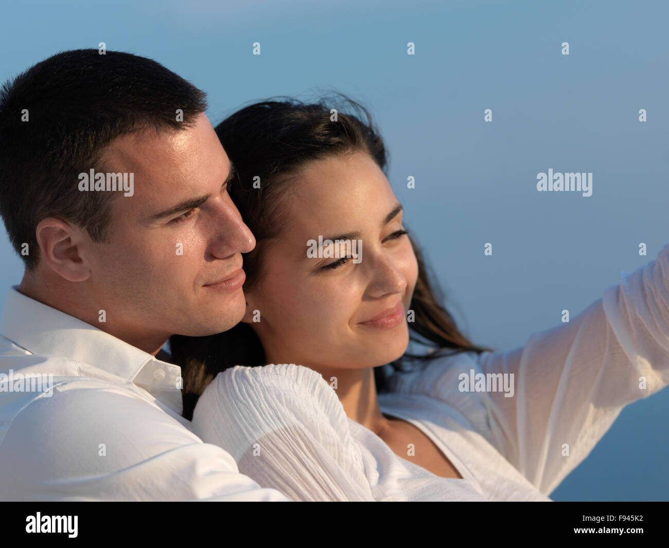 happy young romantic couple have fun relax smile at modern home outdoor ...