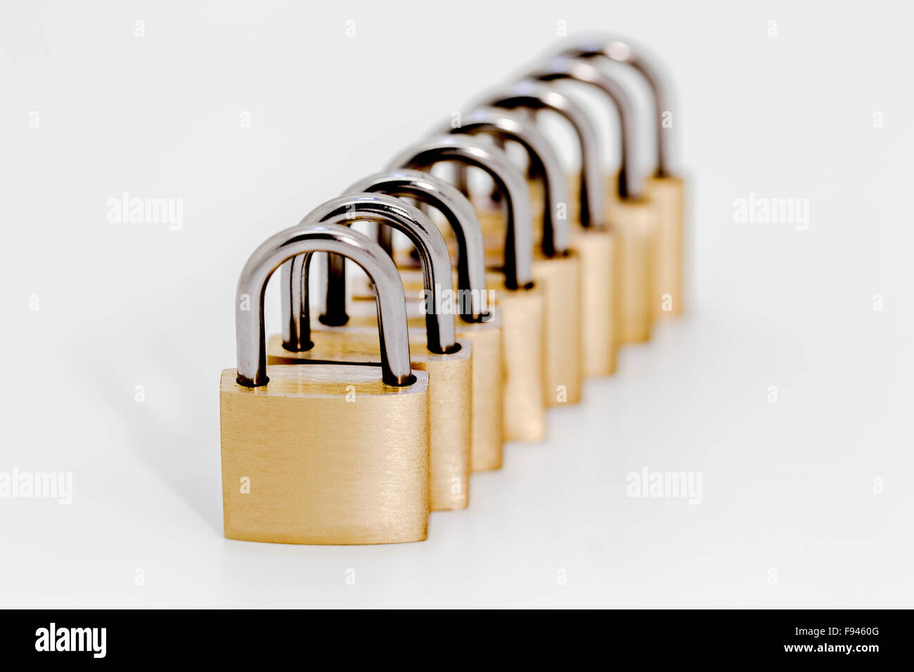Row of locks on white background Stock Photo - Alamy