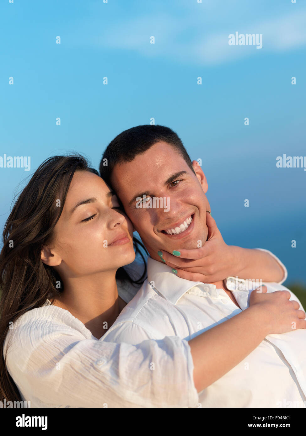 happy young romantic couple have fun relax smile at modern home outdoor ...