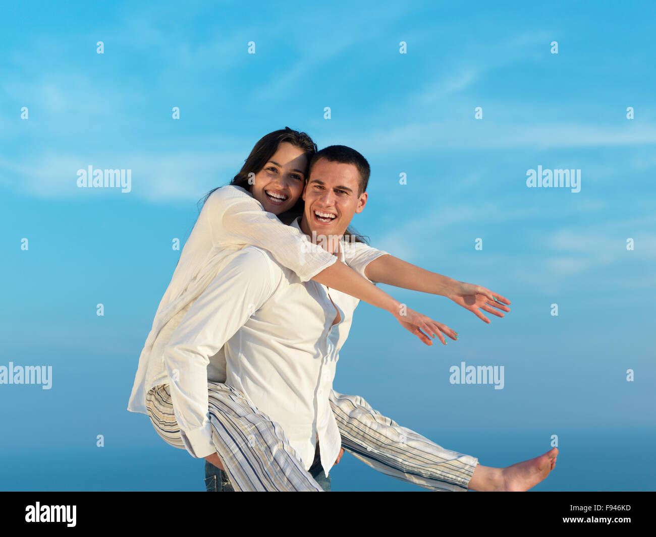 happy young romantic couple have fun relax smile at modern home outdoor ...