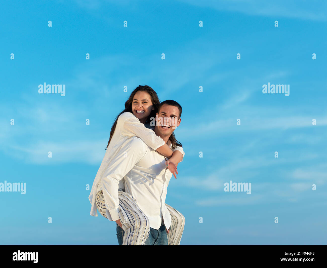 happy young romantic couple have fun relax smile at modern home outdoor ...