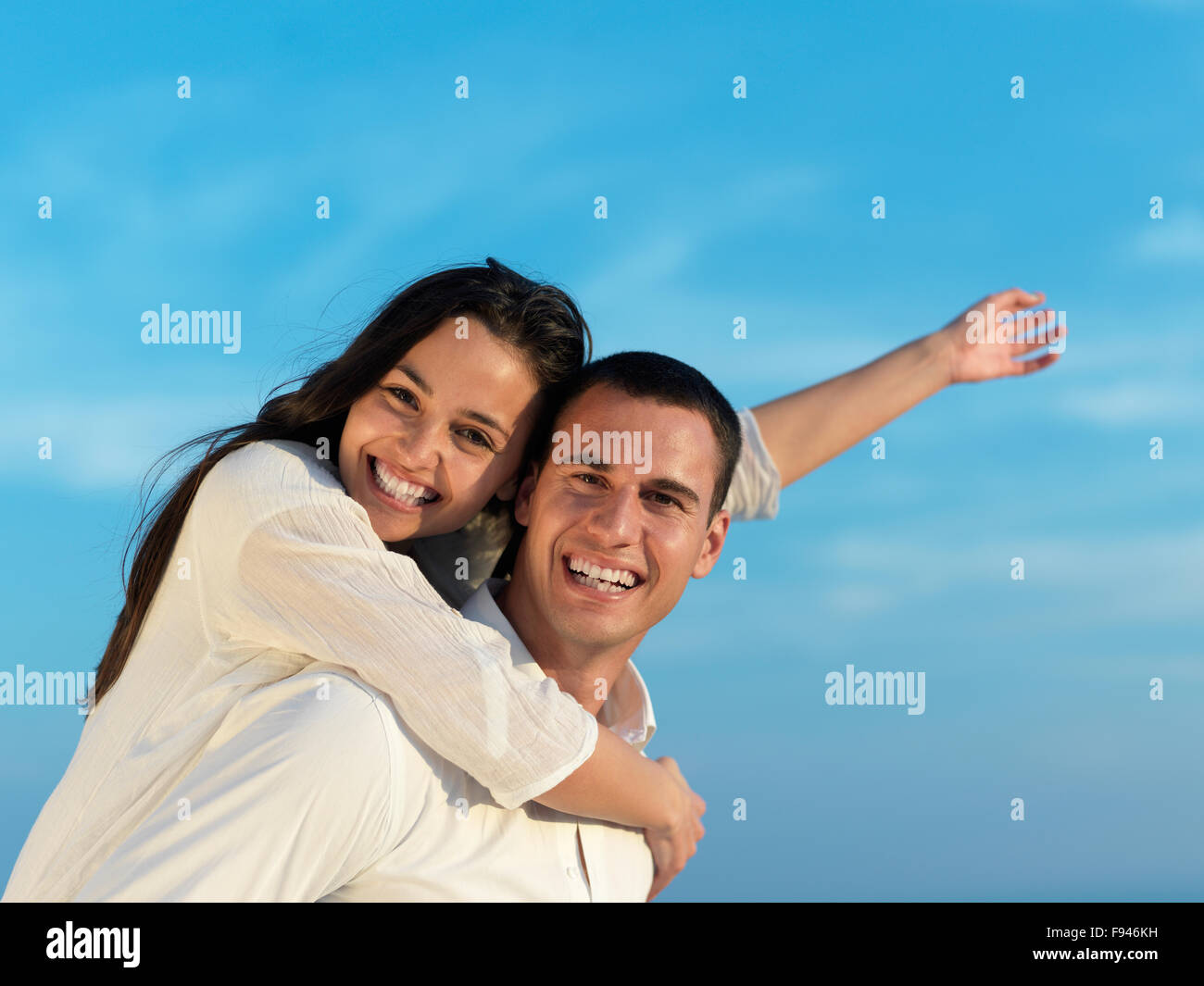happy young romantic couple have fun relax smile at modern home outdoor ...