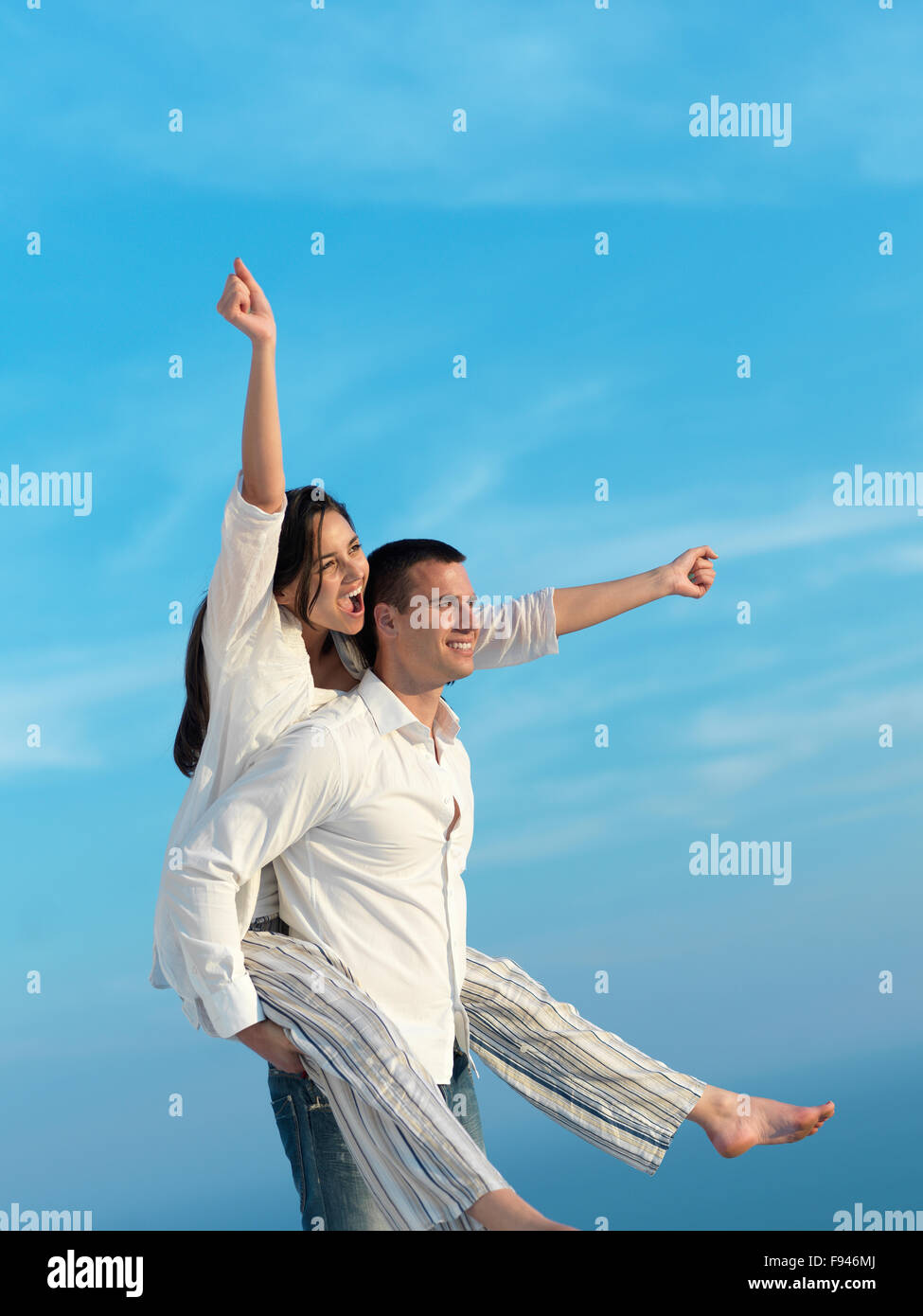 happy young romantic couple have fun relax smile at modern home outdoor ...