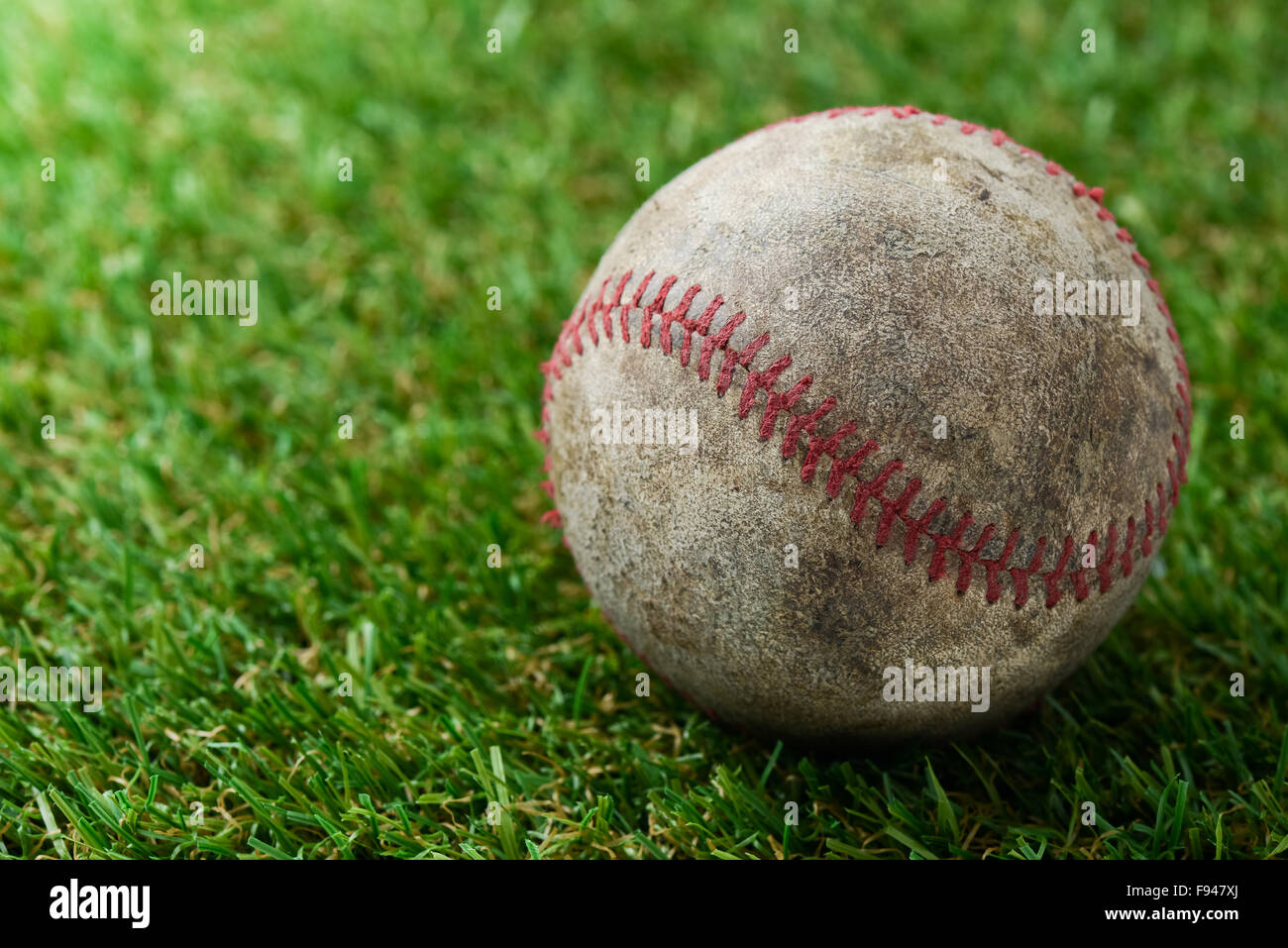 old baseball on grass Stock Photo - Alamy