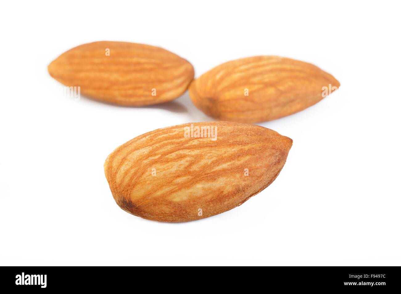 raw almond nuts isolated on white background Stock Photo - Alamy