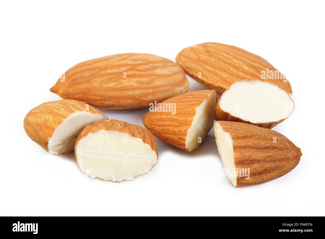 raw almond nuts isolated on white background Stock Photo - Alamy