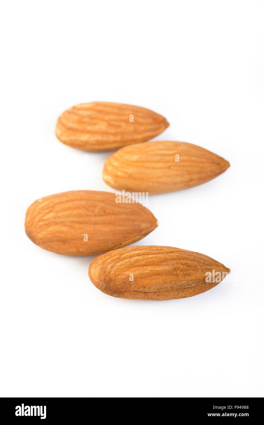 raw almond nuts isolated on white background Stock Photo - Alamy