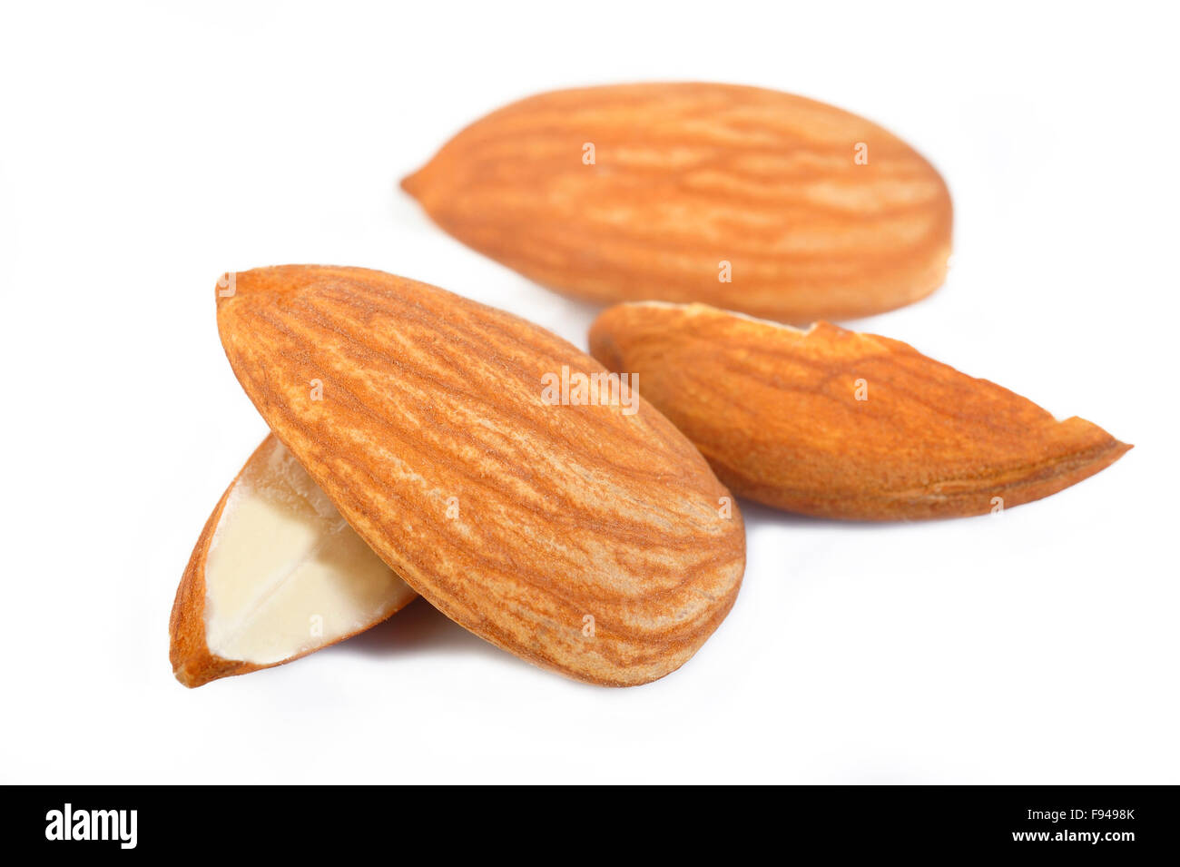 raw almond nuts isolated on white background Stock Photo - Alamy