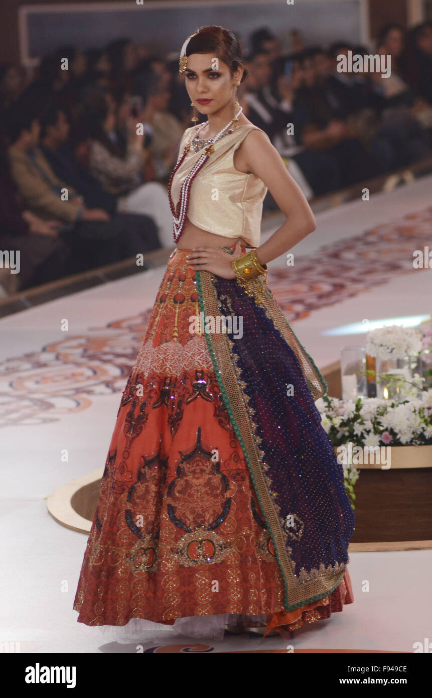 Lahore, Pakistan. 13th Dec, 2015. Pakistani model presents the creation ...